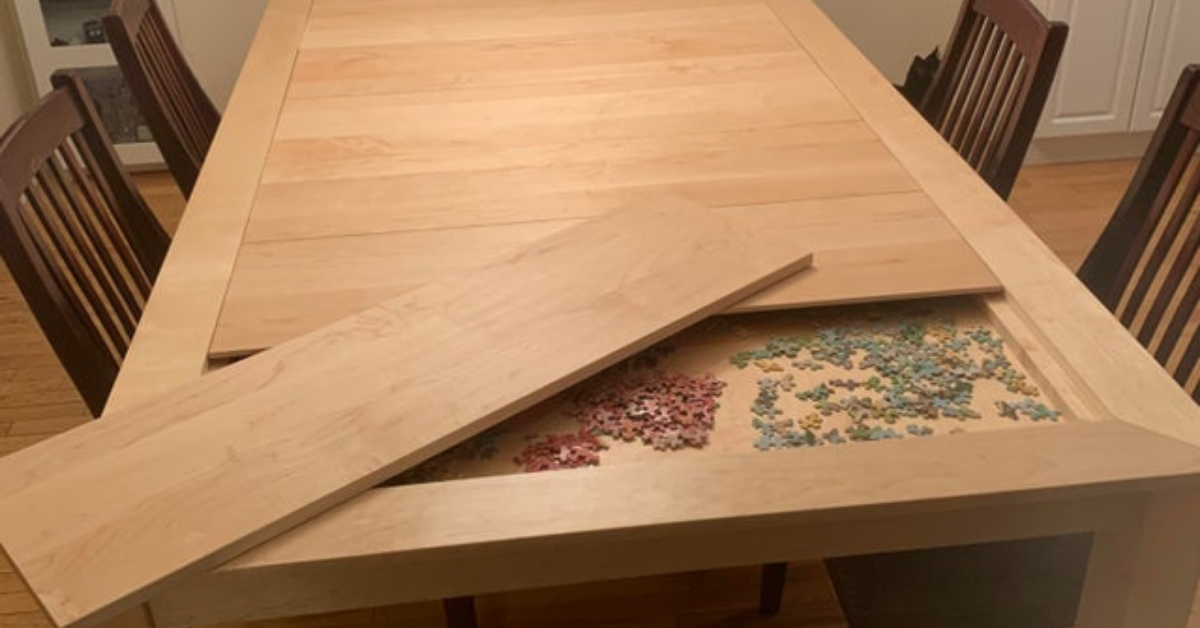 Table with hidden puzzle compartment store